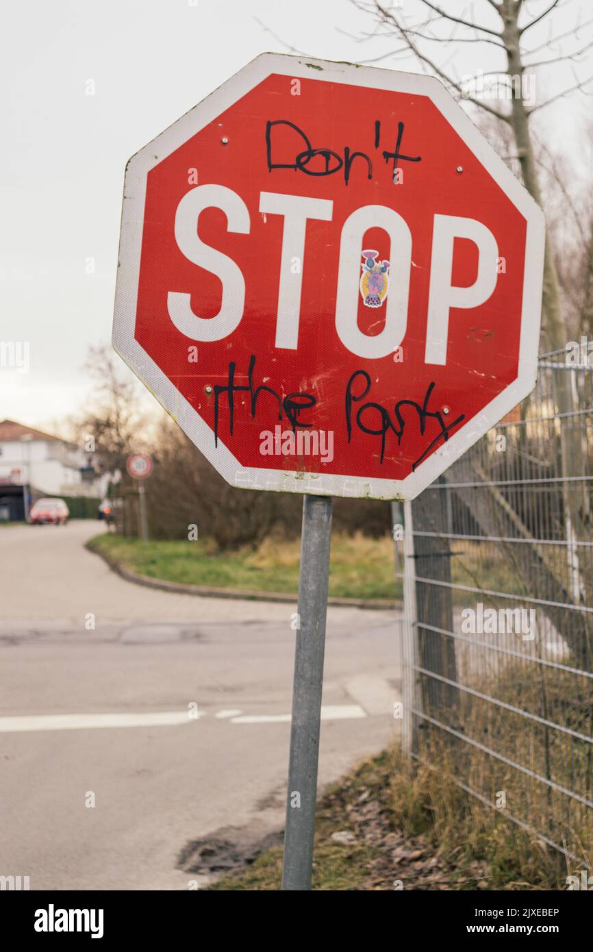 Stop sign with the inscription 'Don't STOP the Party Stock Photo - Alamy