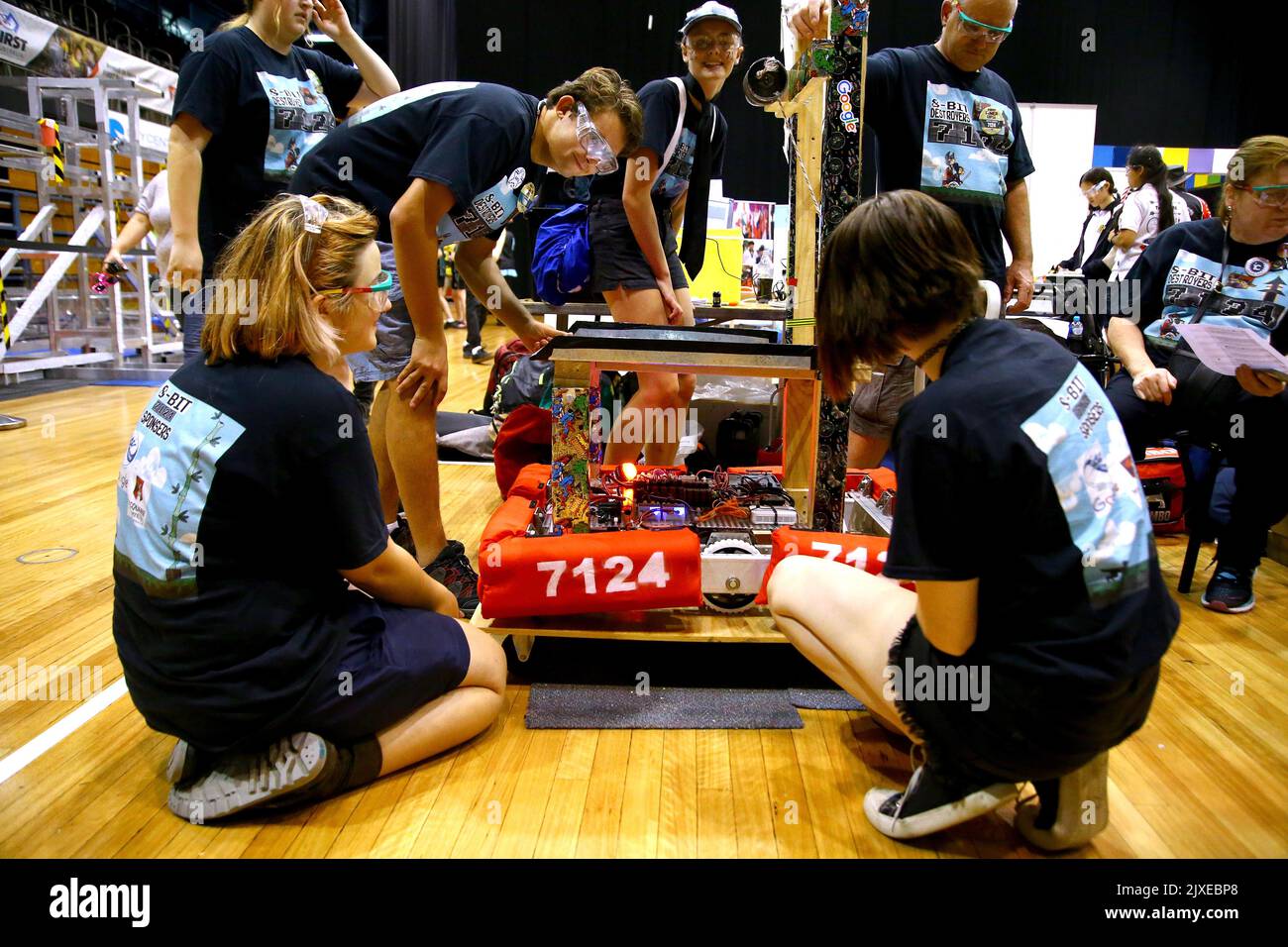 Students prepare their robots for battle in the pit during the FIRST ...