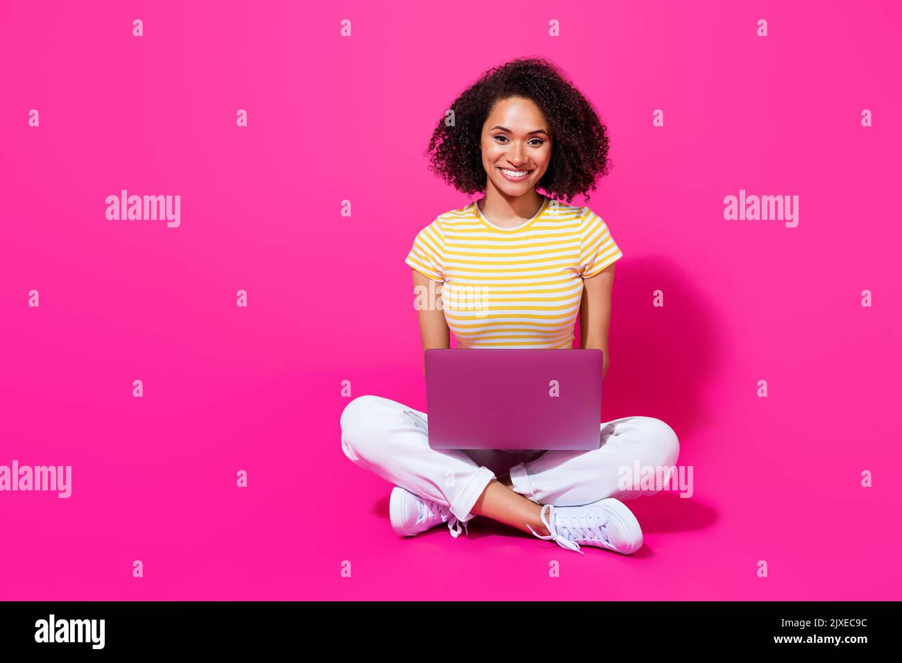 Full length photo of young attractive girl sitting use computer smile ...