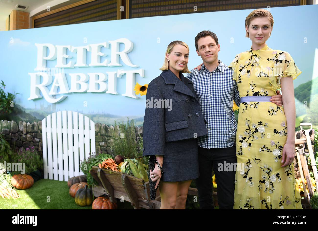 Margot Robbie (left), director Will Gluck and Elizabeth Debicki poses ...