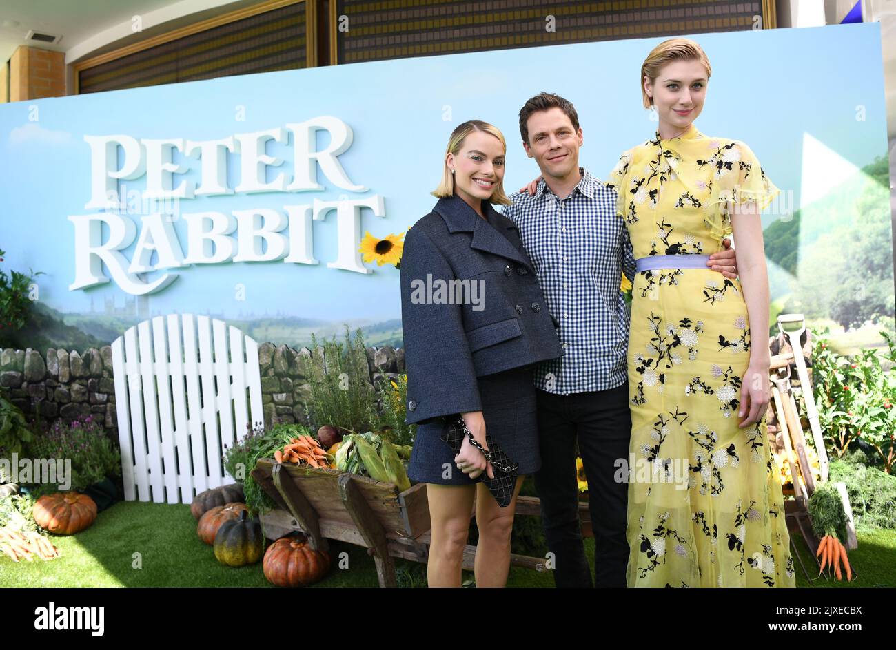 Margot Robbie (left), director Will Gluck and Elizabeth Debicki poses ...