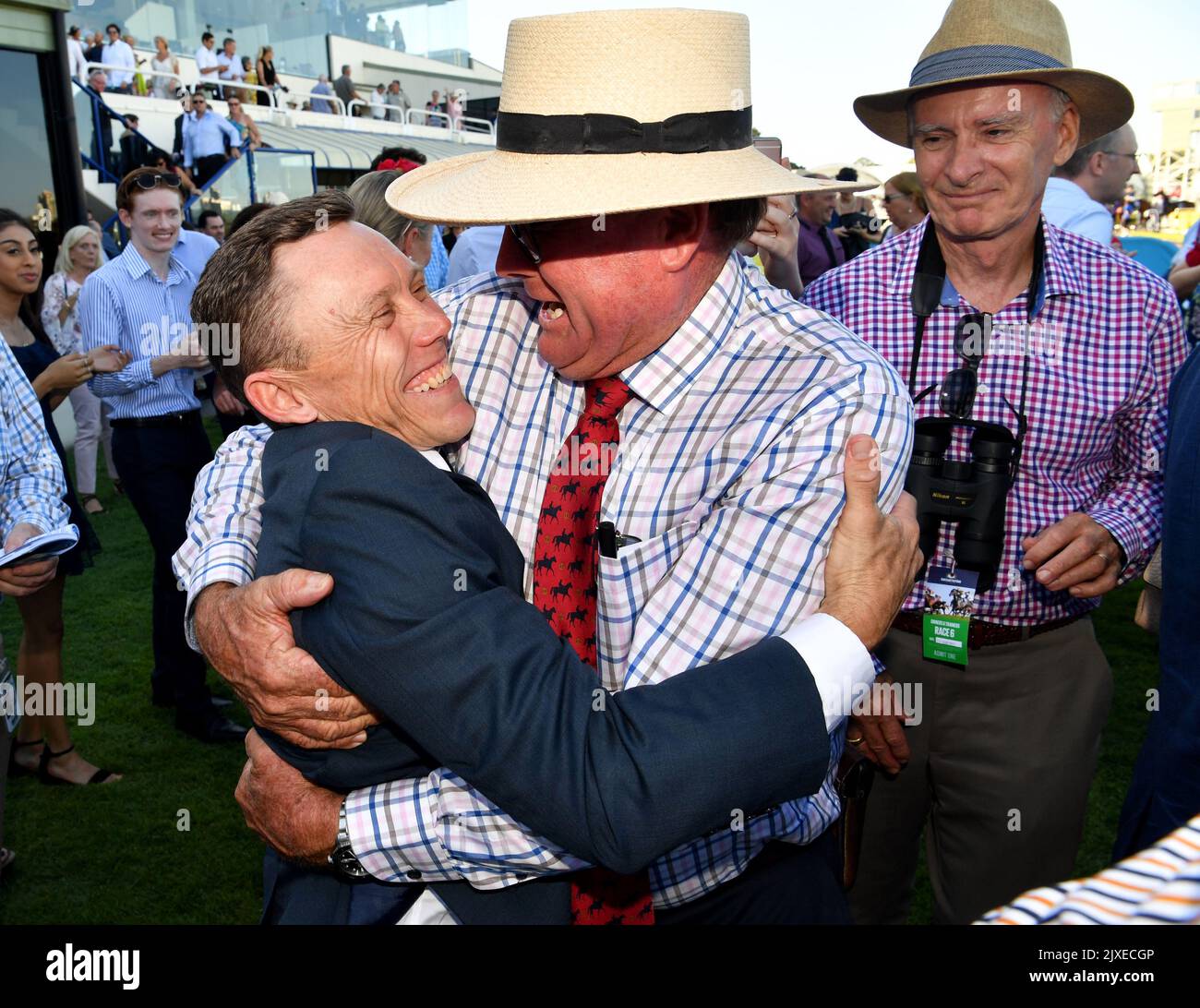 Winning trainer Chris Munce (left) is seen celebrating after his horse ...
