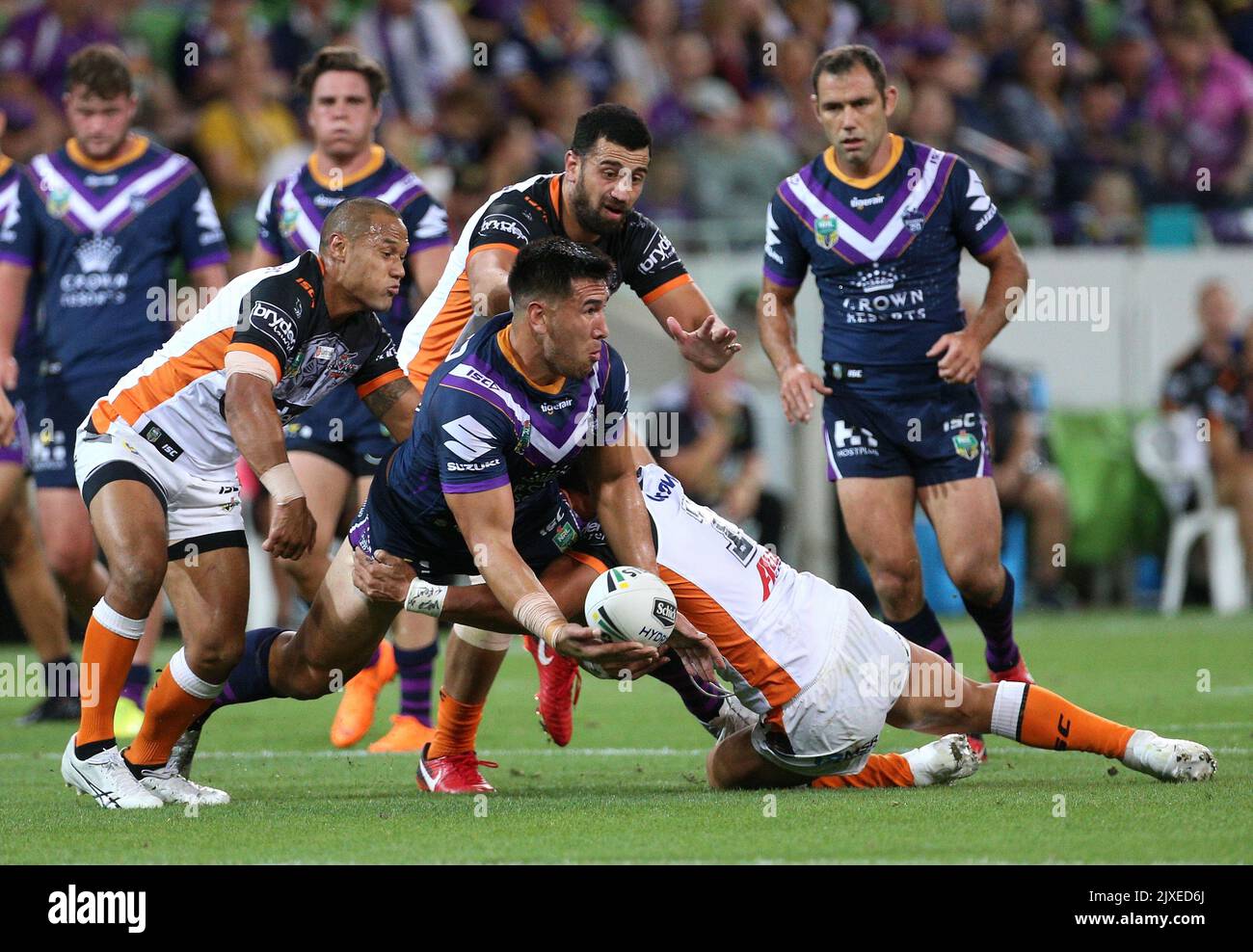 Nelson Asofa-Solomona of the Storm is tackled by Pita Godinet (left ...