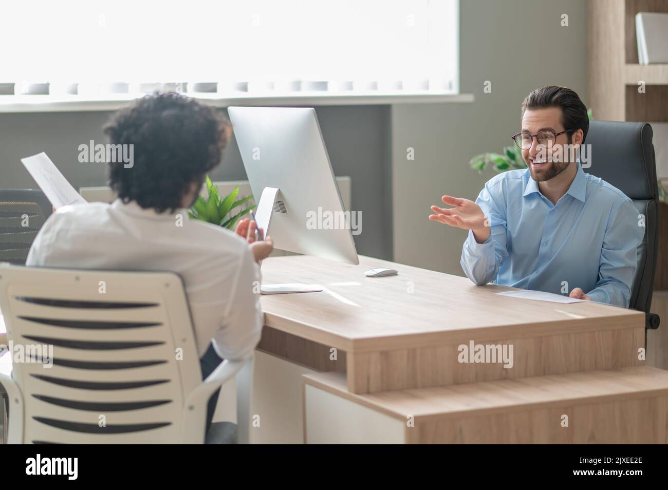 Work on project. Two businessmen looking busy while discussing project ...