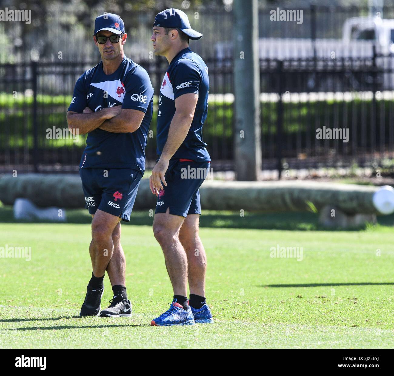 Cooper Cronk (right) of the Sydney Roosters is seen with Andrew Johns ...