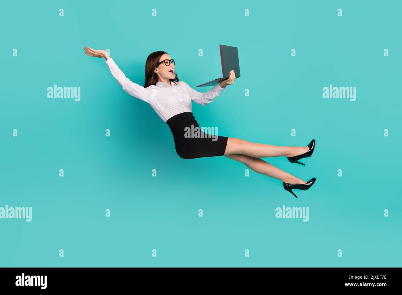 Full size photo of lady marketer falling down levitate air with netbook ...