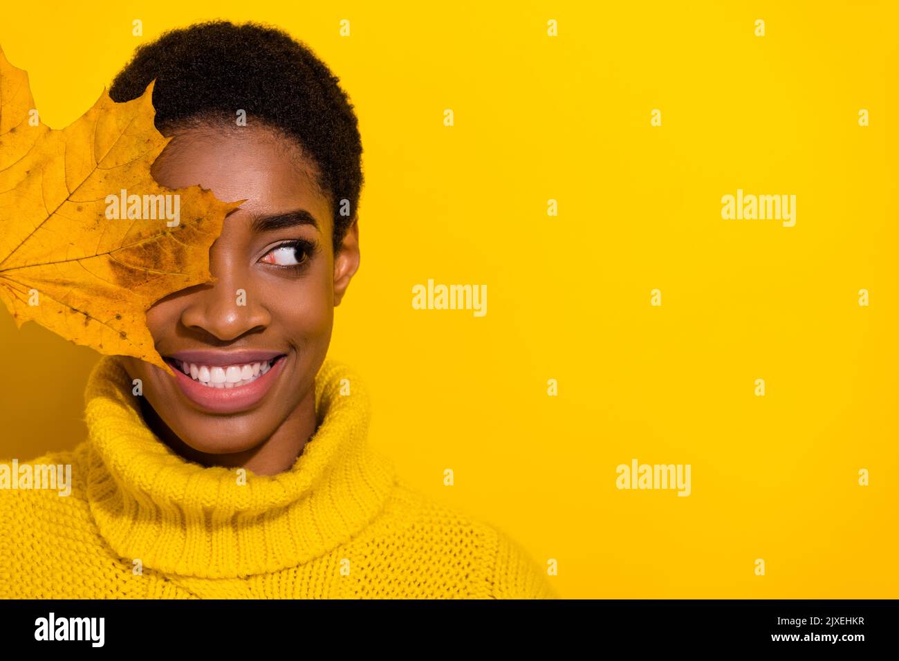Close-up photo of charming lady looking empty space covering face with ...