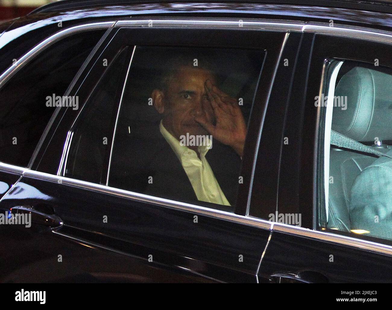 Former US president Barack Obama is seen inside a motorcade in Sydney ...