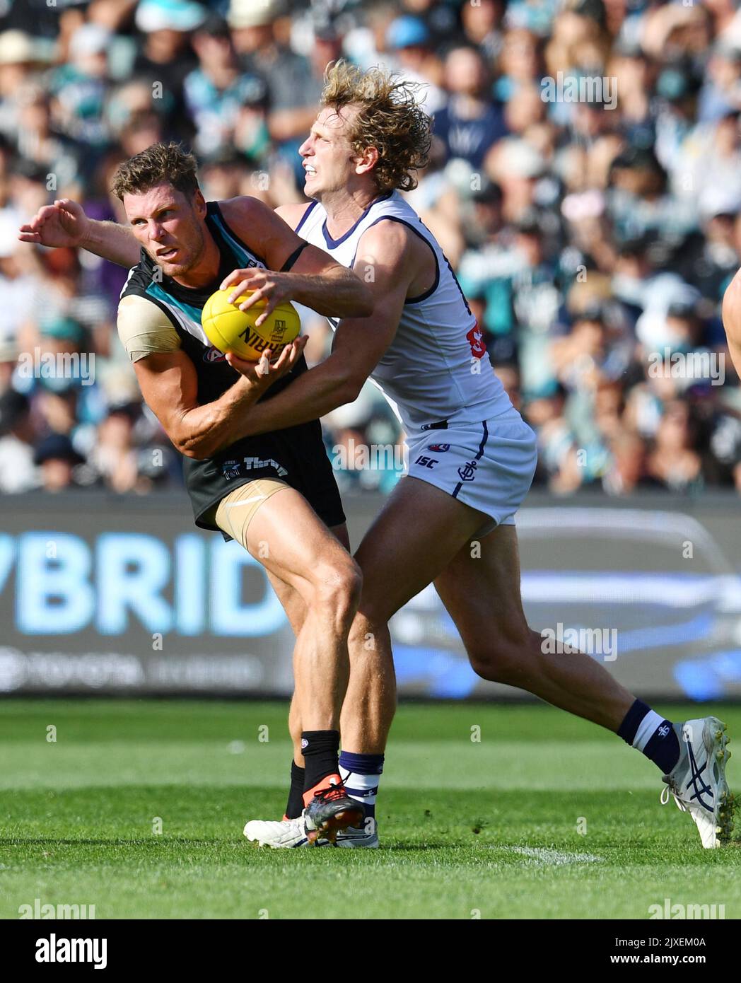 Brad Ebert of the Power and David Mundy of the Dockers clash during the Round 1 AFL match ...
