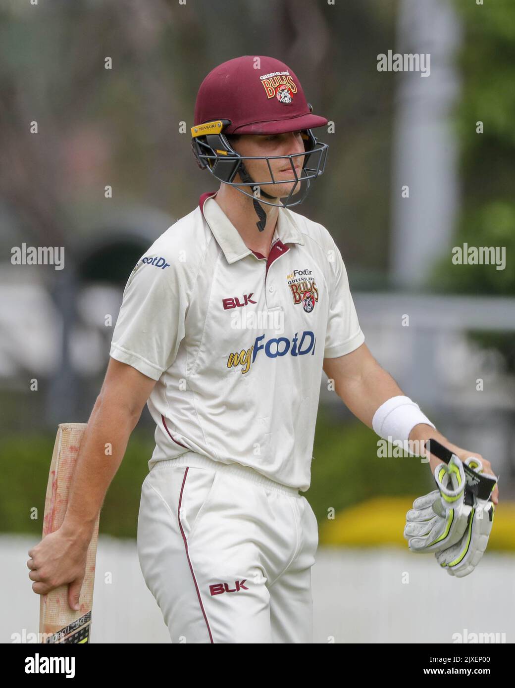 Jack Wildermuth of the Bulls leaves the field after getting out during ...