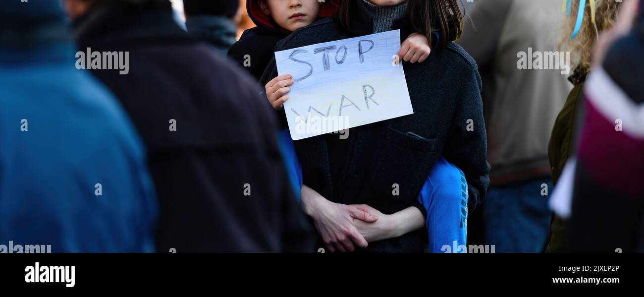 Stop war signage placard banner in teen male hand at protest Stock ...