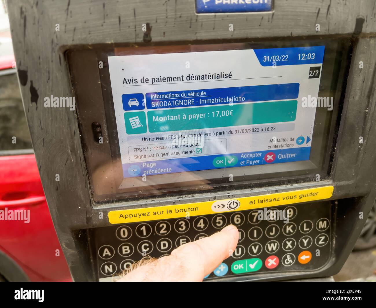 Strasbourg, France - Mar 31, 2022: POV male hand using Parkeon parking ...