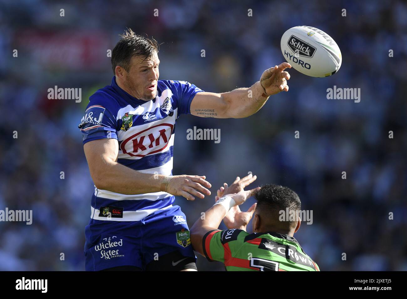 Brett Morris of the Bulldogs flicks a pass off to set up a Joshua ...