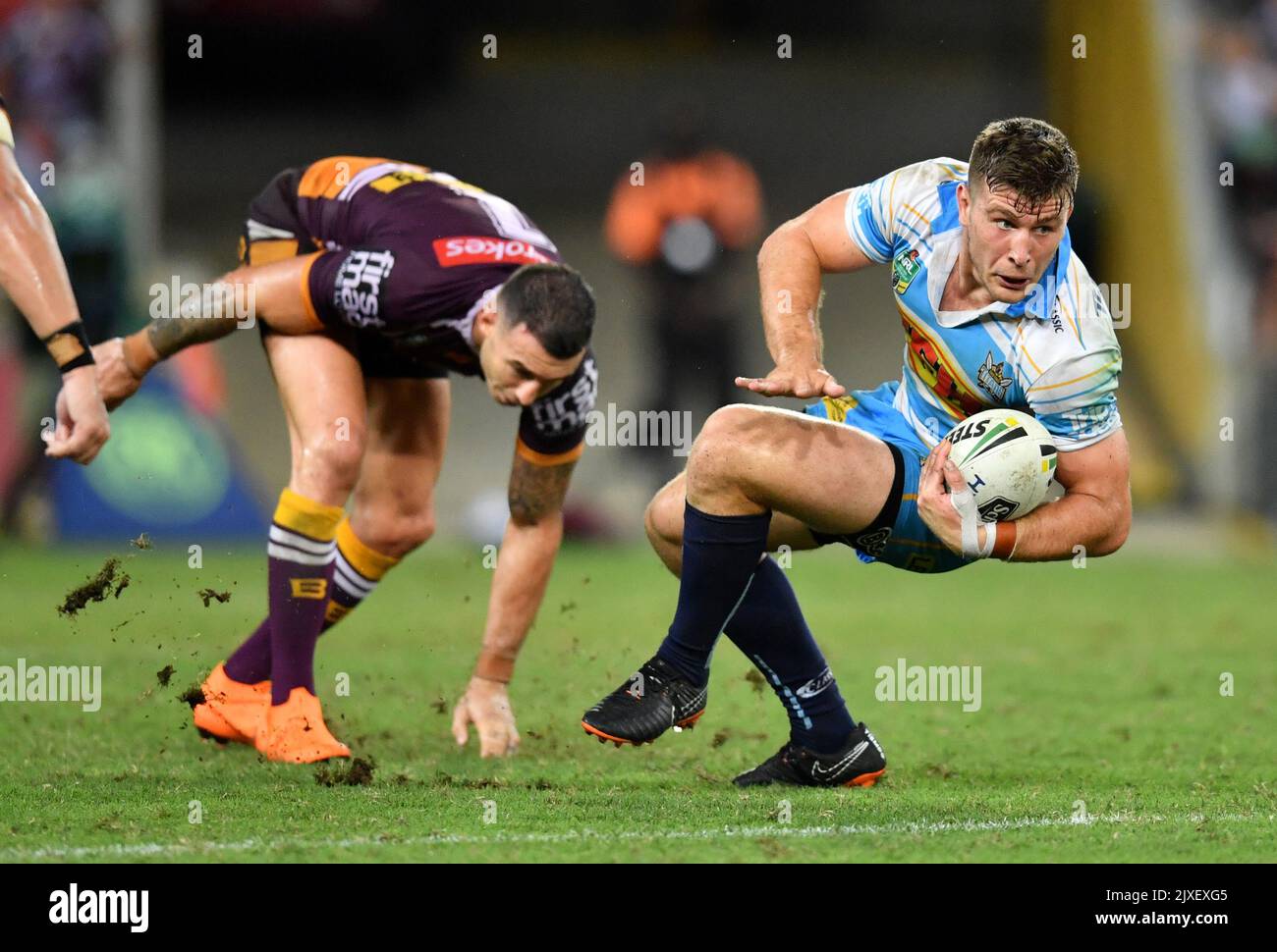 Jai Arrow (right) of the Titans gets past Darius Boyd (left) of the ...