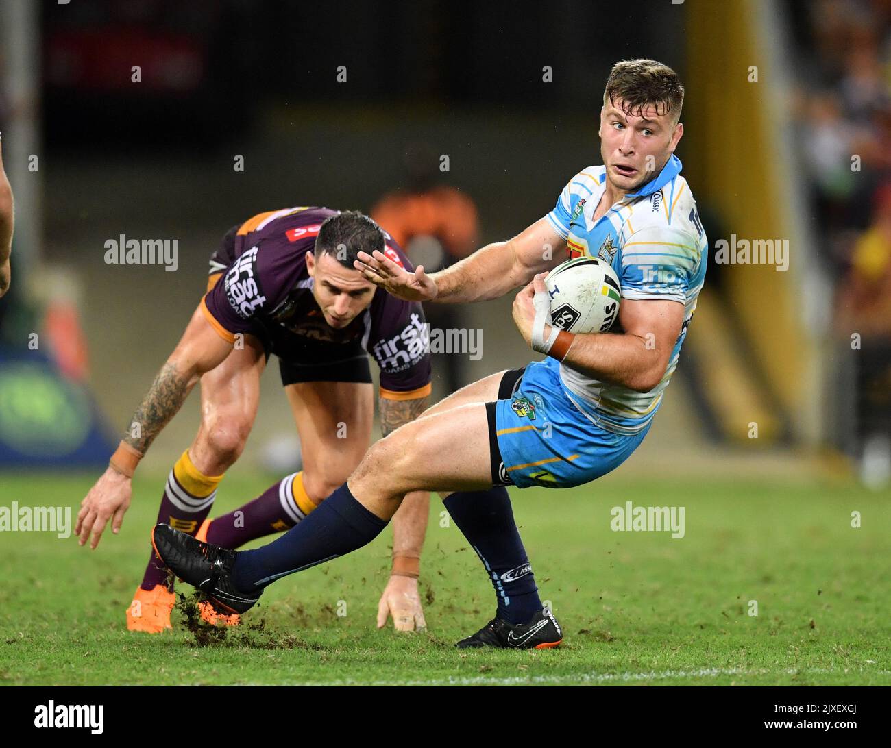 Jai Arrow (right) of the Titans gets past Darius Boyd (left) of the ...