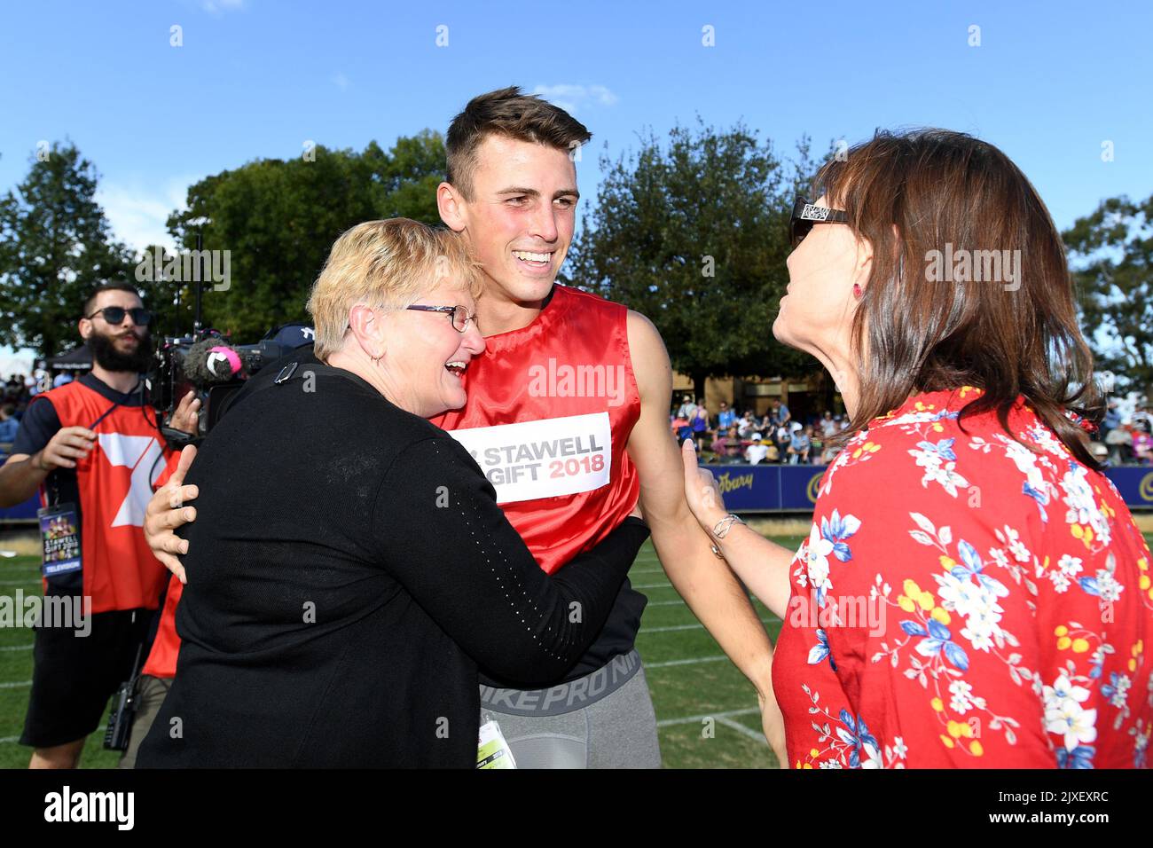 Sprinter Jacob Despard (centre) from Tasmania celebrates with mom and ...