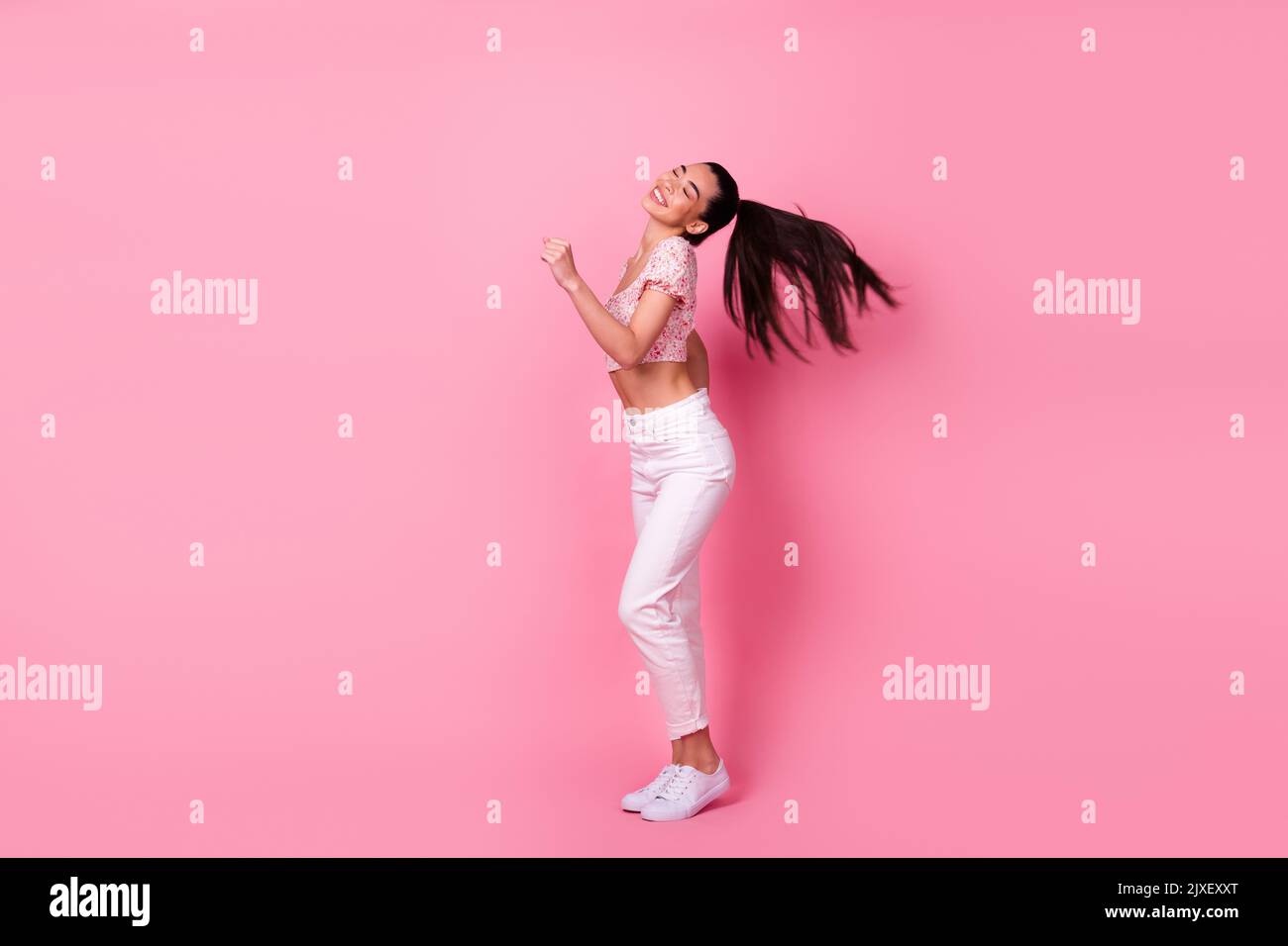 Full length photo of satisfied positive vietnamese girl clubbing ...