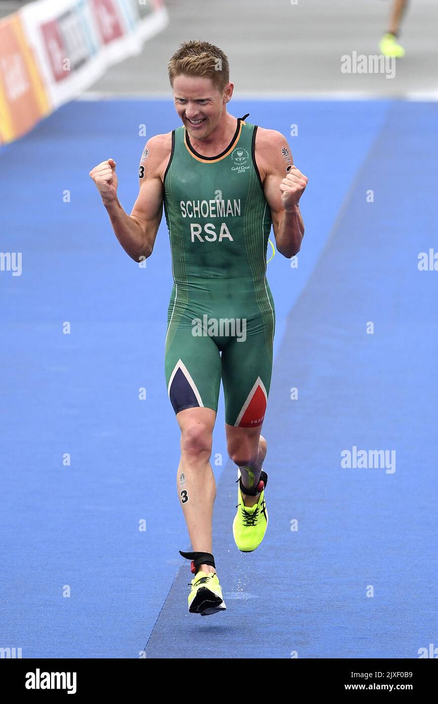 Henri Schoeman of South Africa gestures as he crosses the finish line ...
