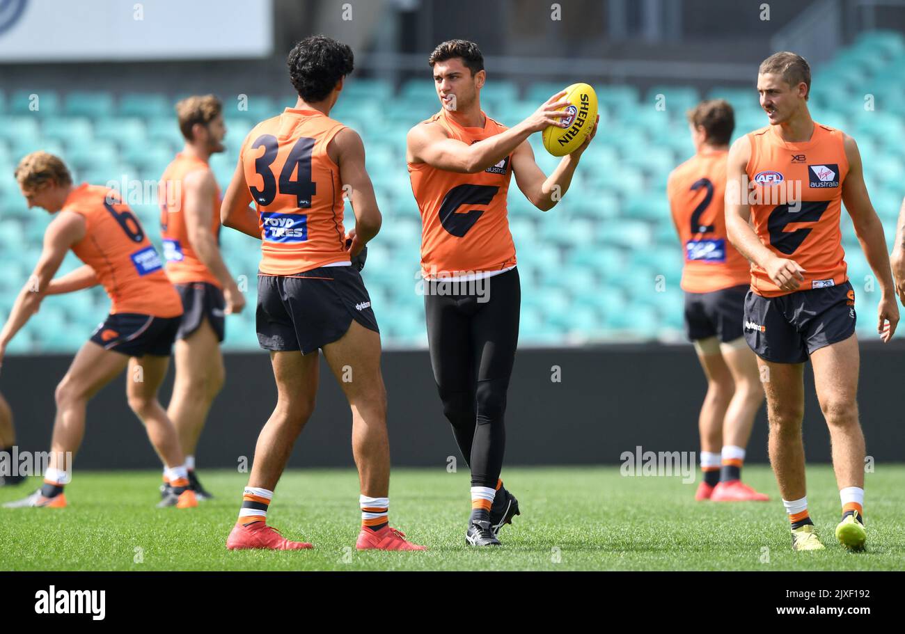 Tim Taranto of the Giants (centre) with his teammates during a GWS ...
