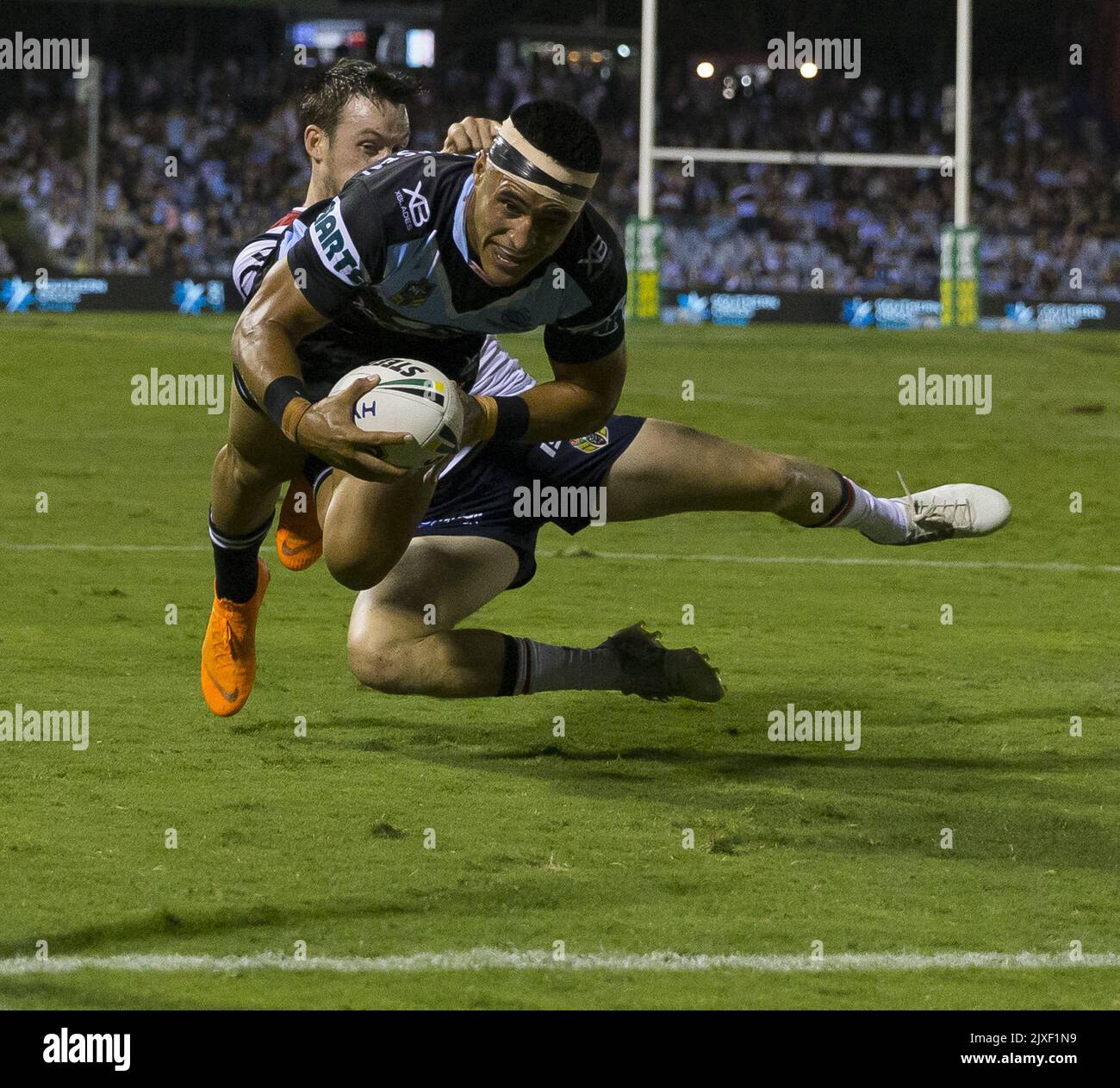 Valentine Holmes of the Sharks scores during the Round 5 NRL match ...