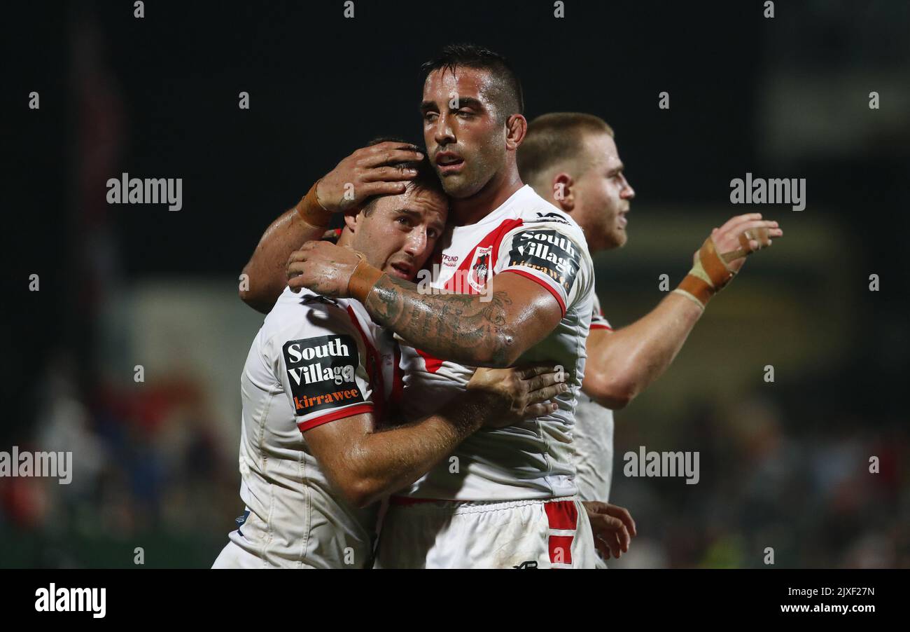 Ben Hunt and Paul Vaughan of the Dragons react after winning the Round ...