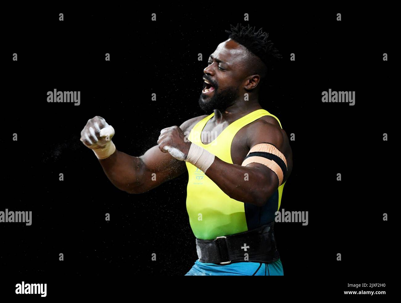 Francois Etoundi of Australia attempts his first lift in the Men's 77kg ...