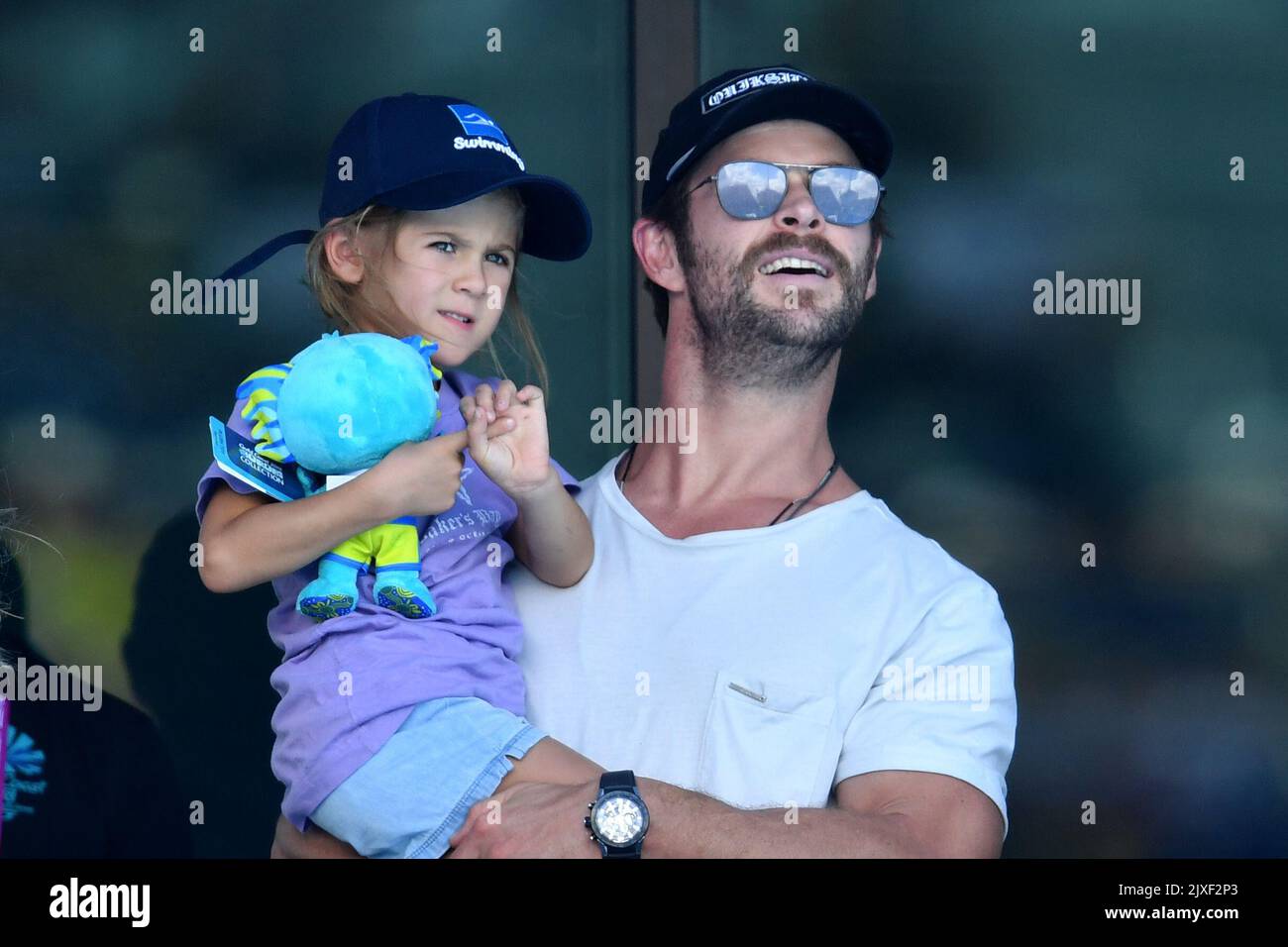 Actor Chris Hemsworth and his daughter India Rose watch the swimming ...