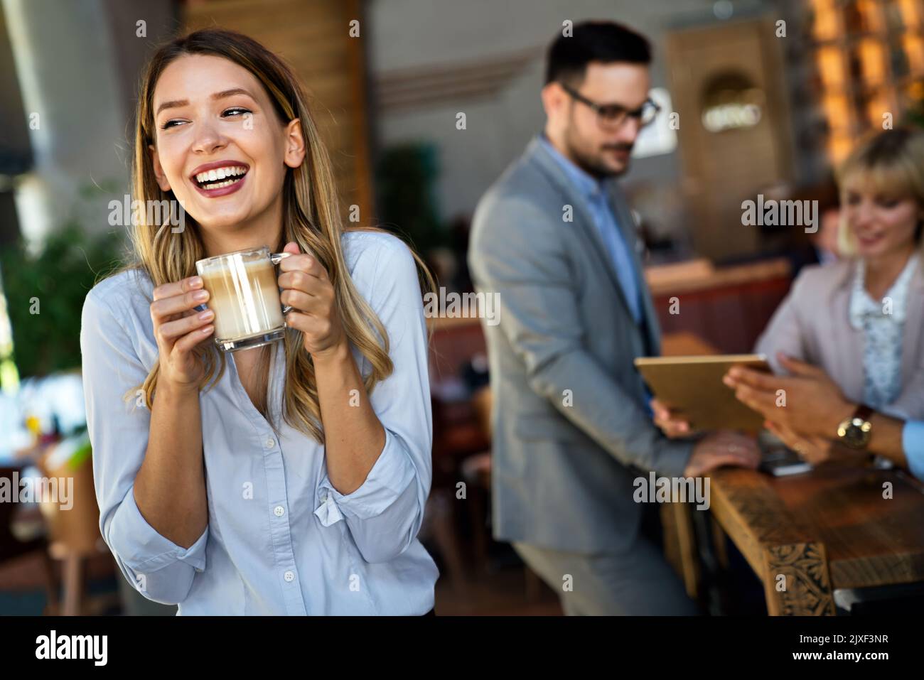 Business colleagues having conversation during coffee break Stock Photo ...