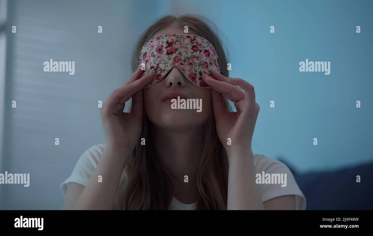 Wearing sleep mask hi-res stock photography and images - Alamy