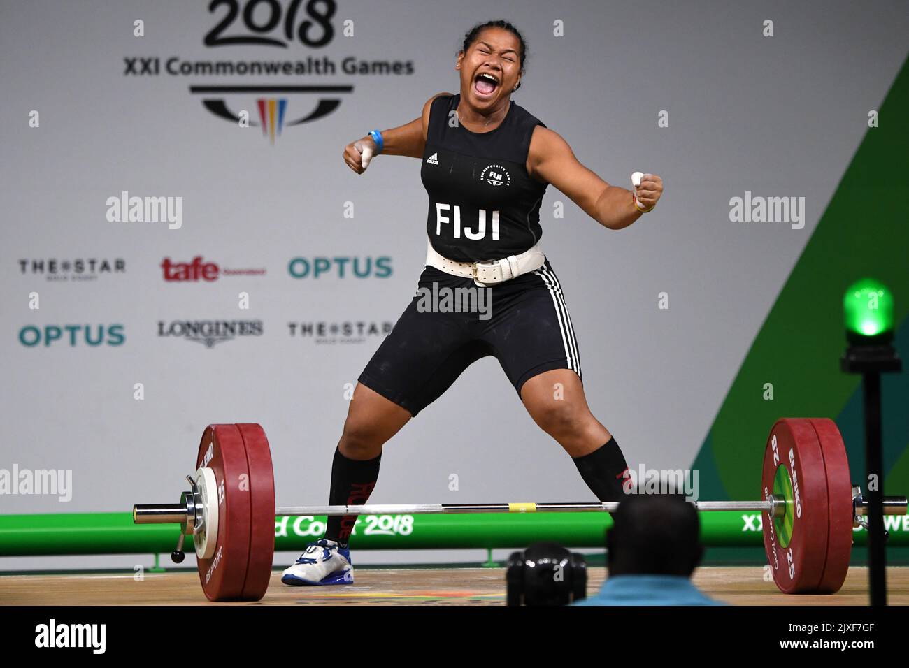 Eileen Cikamatana celebrates after a successful lift during the Women's ...