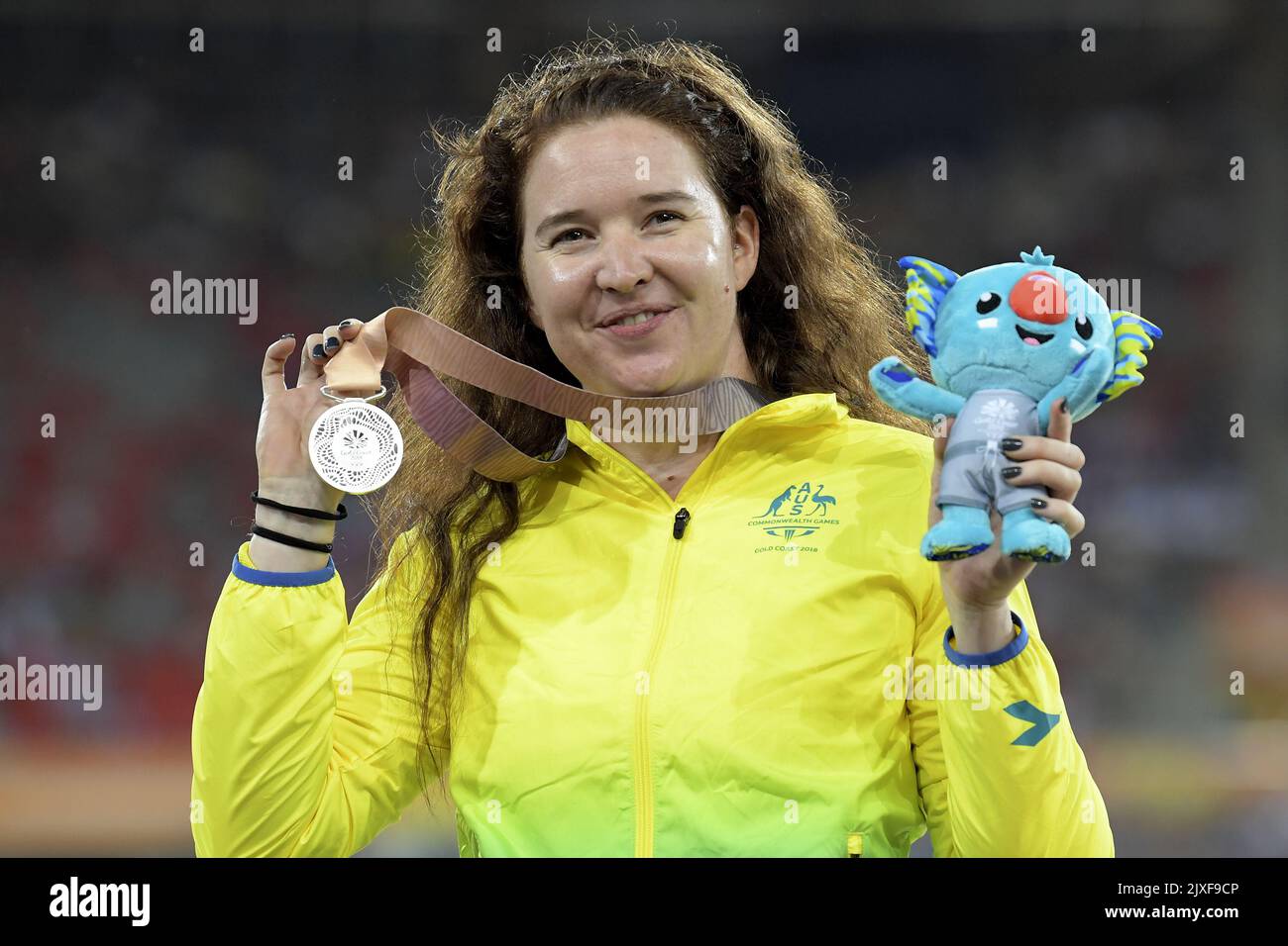 Angela Ballard of Australia poses for a photograph after recieving the ...