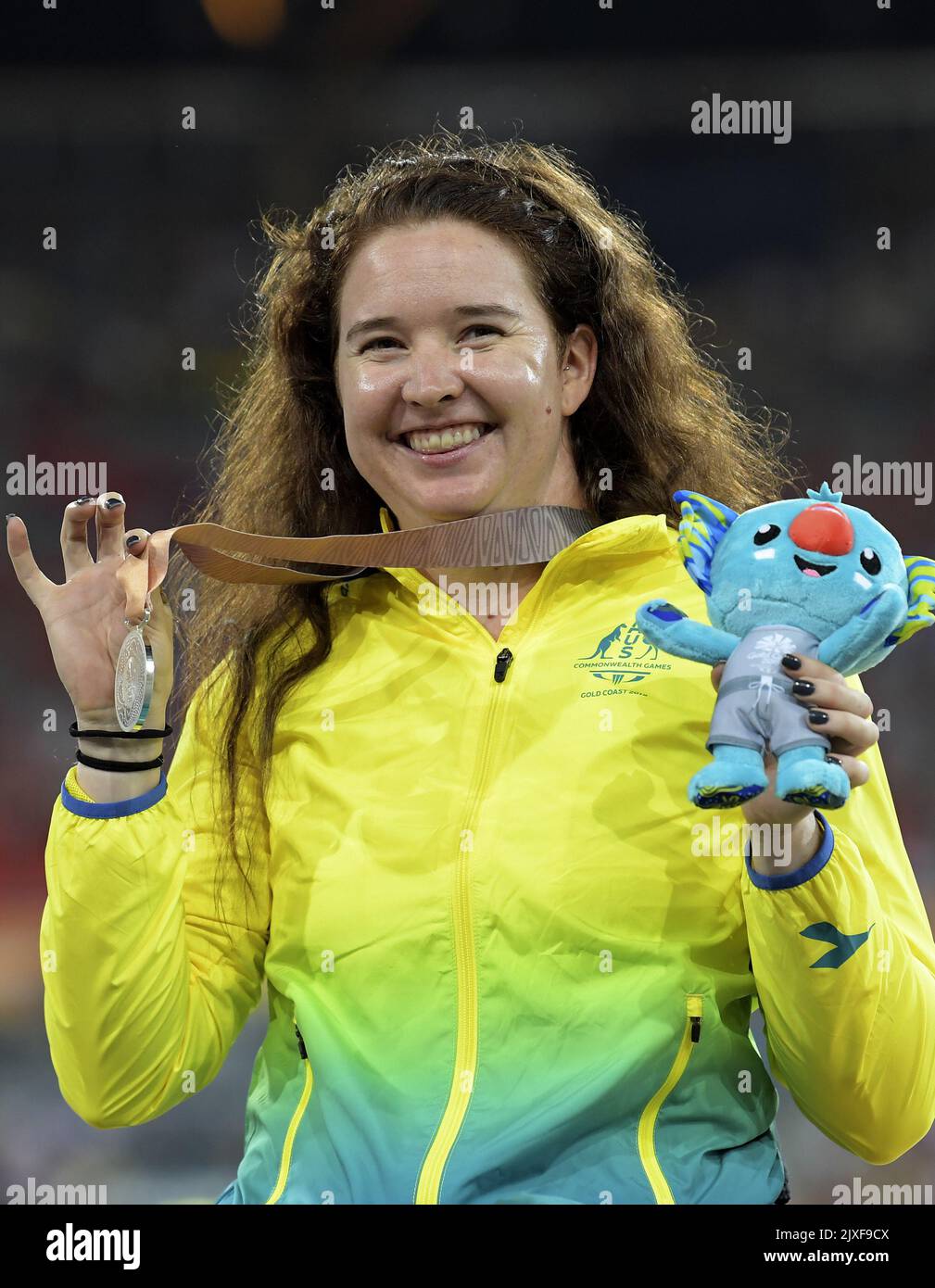 Angela Ballard of Australia poses for a photograph after recieving the ...