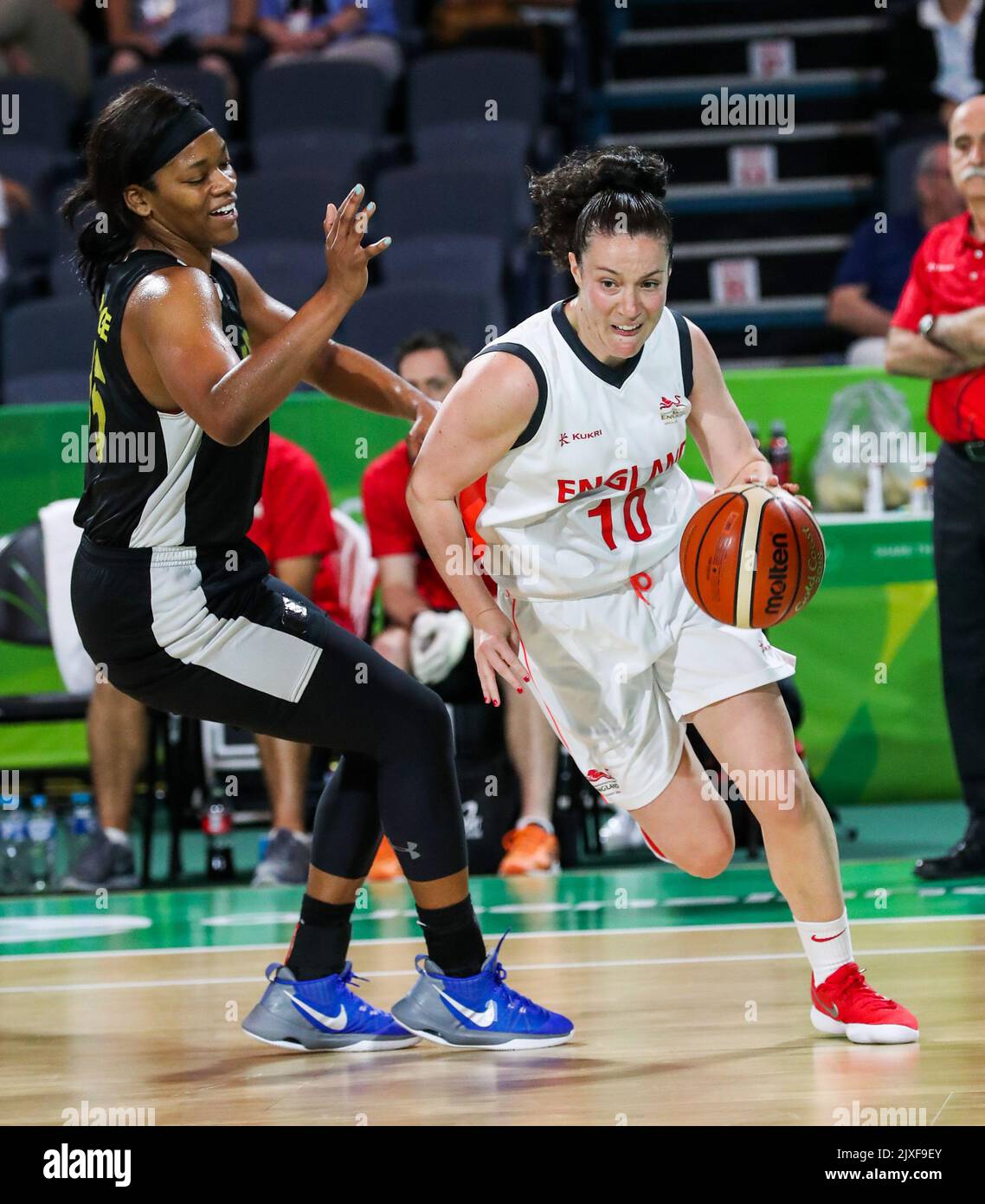 Eilidh Simpson of England makes her way past Jennifer George of Jamaica ...