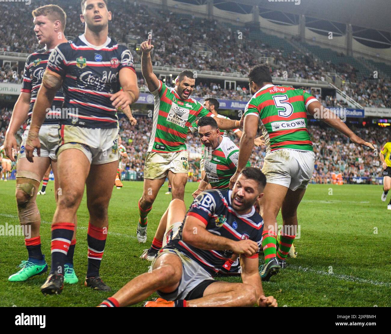 John Sutton (centre) reacts after scoring for the Rabbitohs during the ...