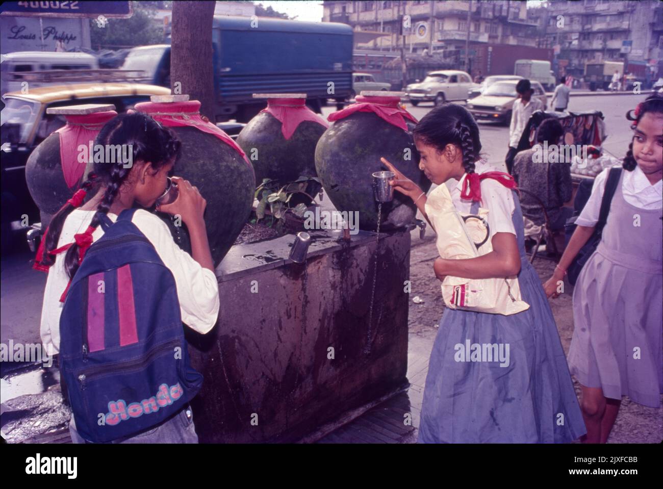 School Girls drinking water at public water points Stock Photo - Alamy