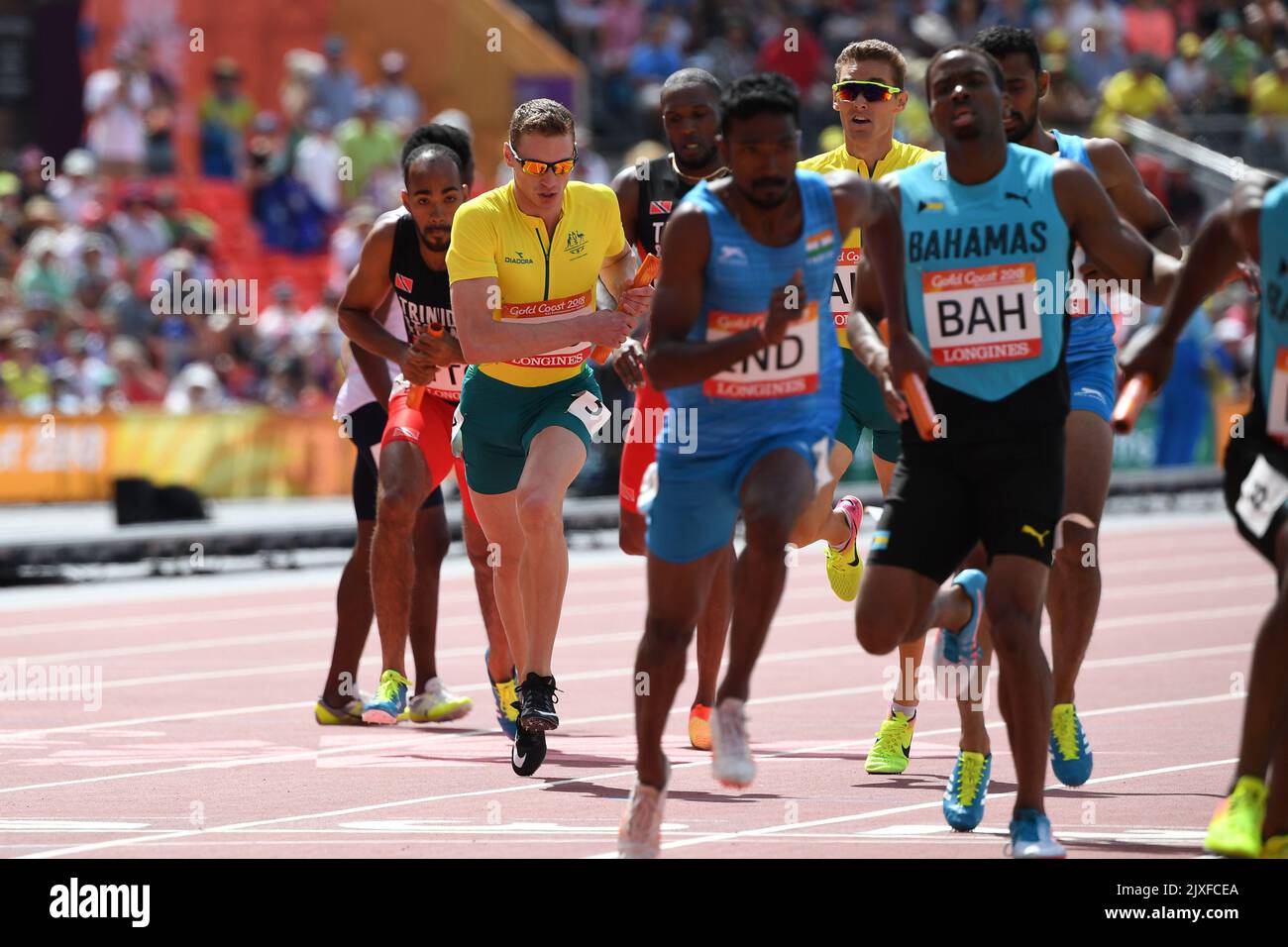 Australia's Steve Solomon receives the baton from Joshua Ralph during ...
