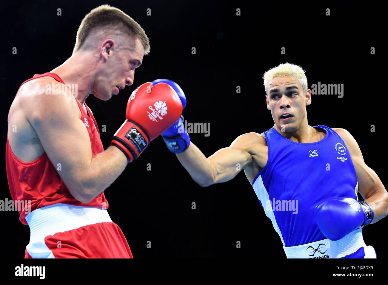 Jason Whateley of Australia (left) fights David Nyika of New Zealand in ...