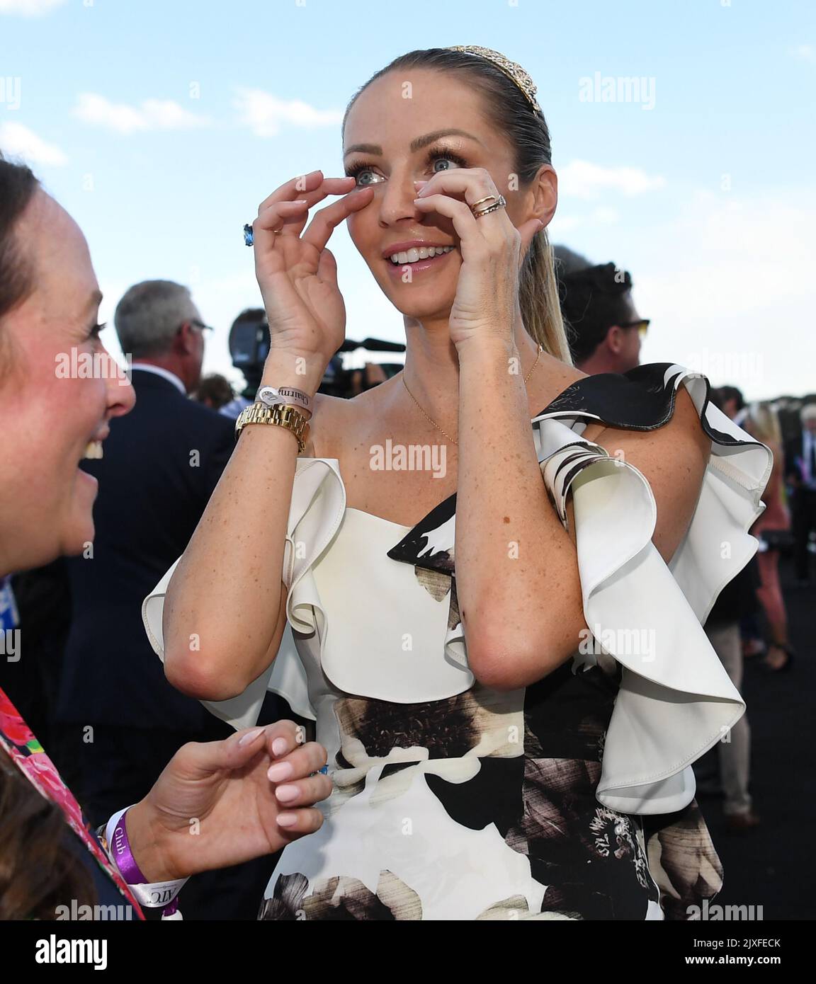 Stephanie Waller, the wife of horse trainer Chris Waller, wipes tears ...