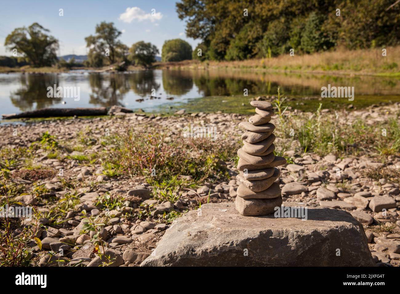 small stone tower on the renaturalized and redesigned Lenne river in ...