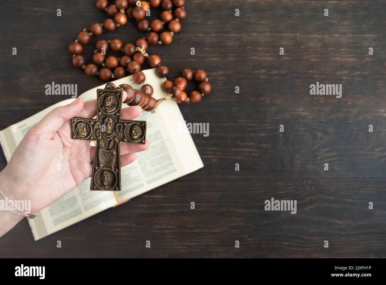 Hand holding cross, symbol of symbol of Christianity. Religion and ...