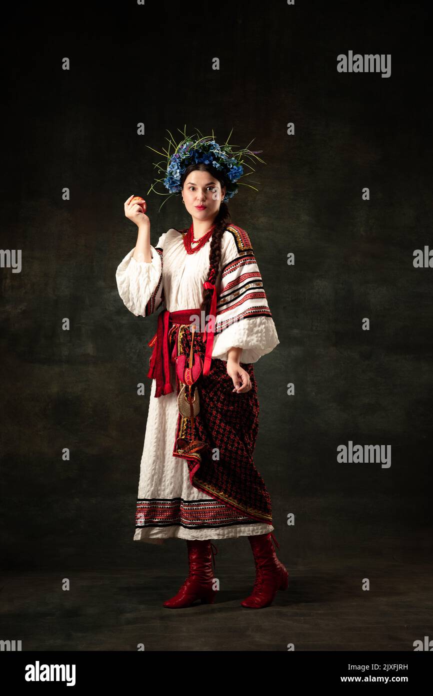 Adorable woman wearing national folk Ukrainian attire posing isolated ...
