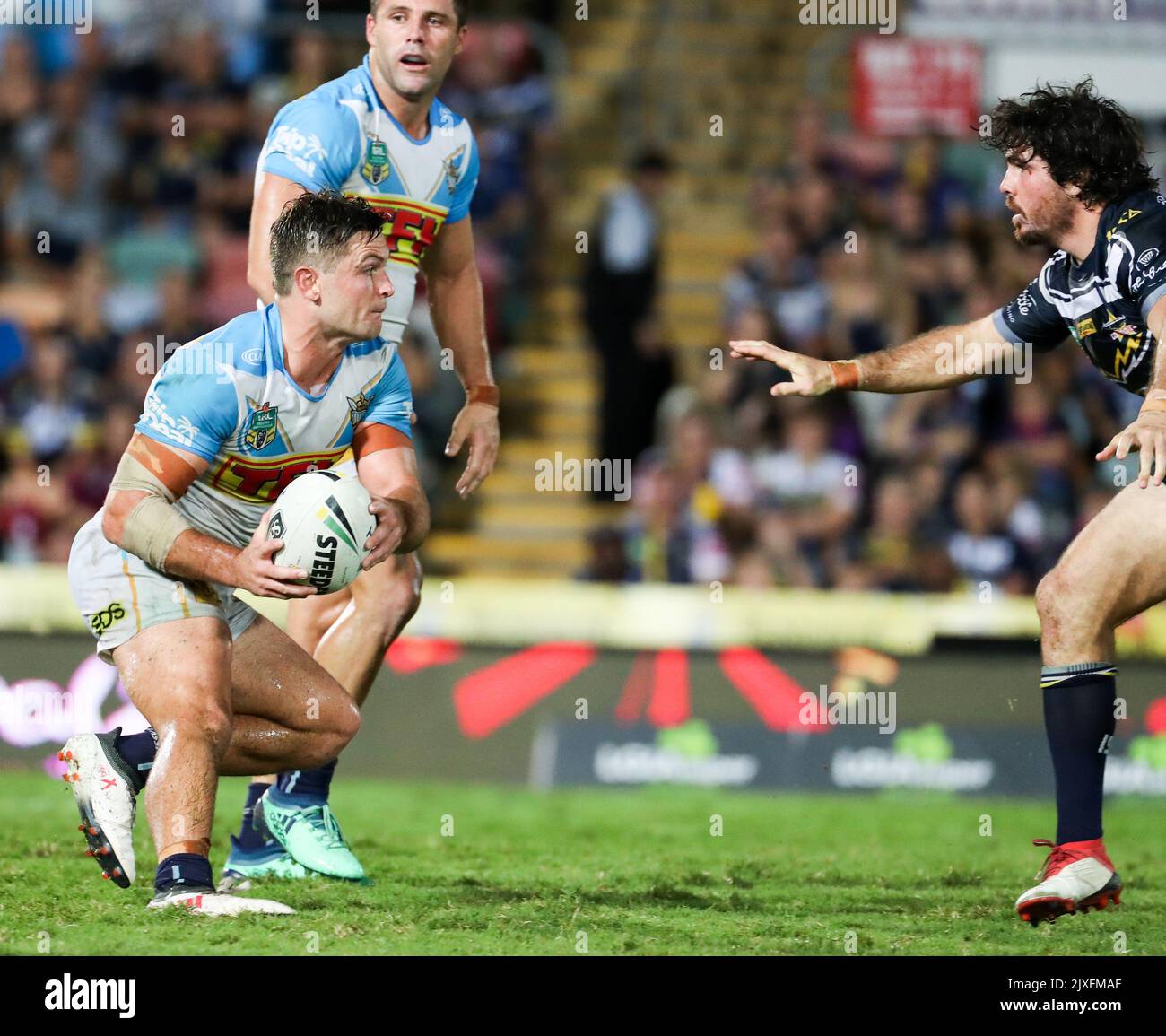 Mitch Rein of the Titans brings the ball up to Jake Granville of the ...