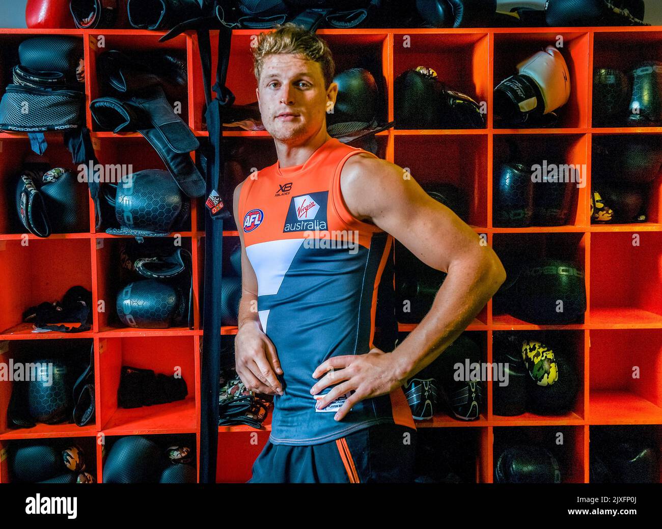 AFL midfielder Jacob Hopper poses for a photograph following a GWS ...