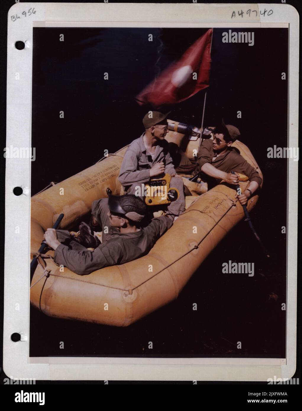 Three B-17 Gunners Practice Dinghy Drill. One Man Turns The Crank On A ...
