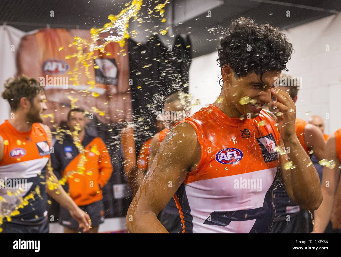 Nick Shipley of the Giants is sprayed in the rooms after his debut ...
