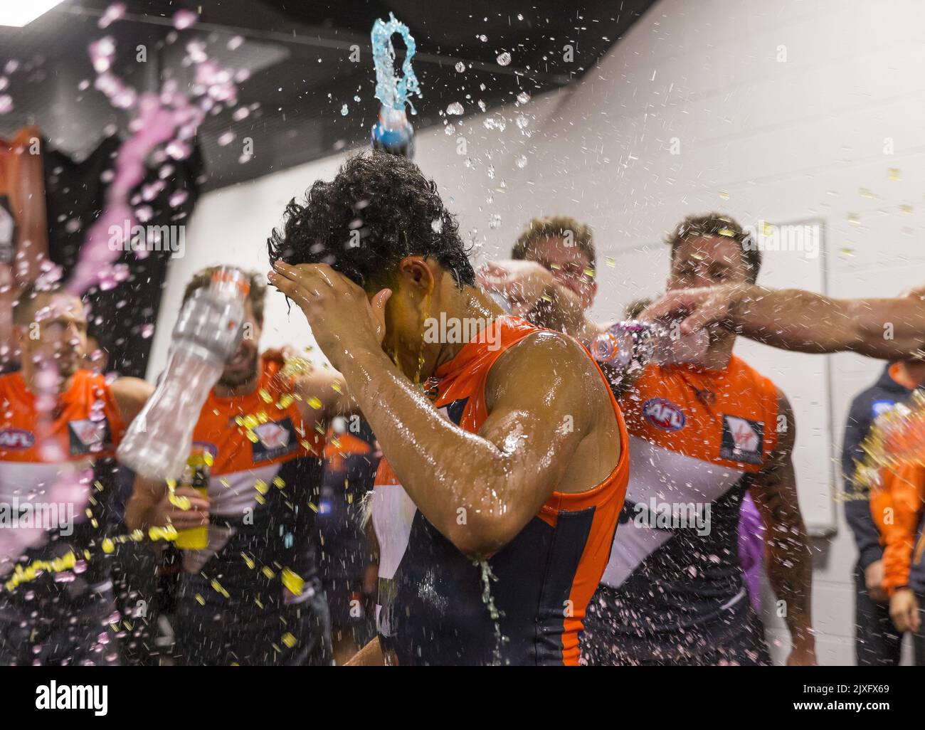 Nick Shipley of the Giants is sprayed in the rooms after his debut ...