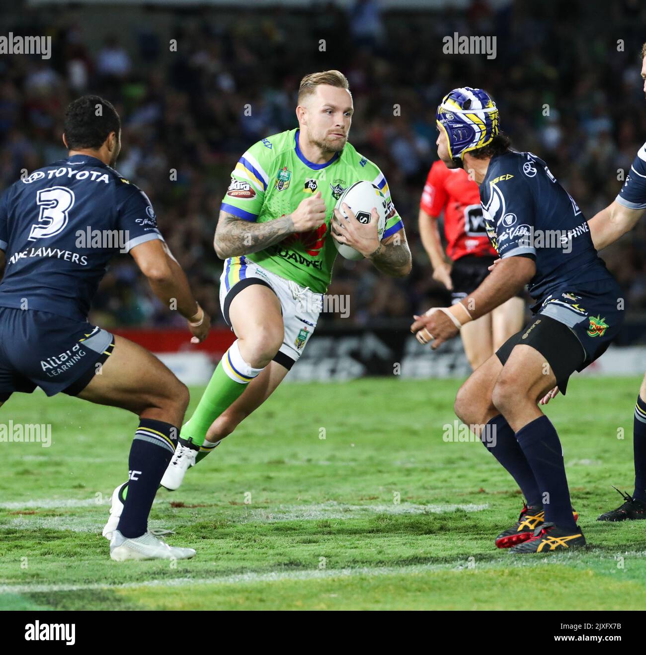Blake Austin of the Raiders looks for a gap in the Cowboys defence ...