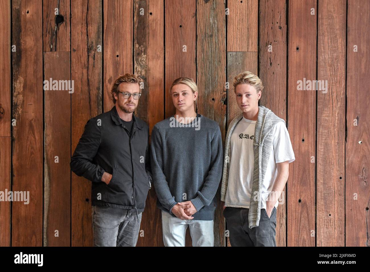 Simon Baker (left) poses for photos with fellow cast members Ben Spence ...