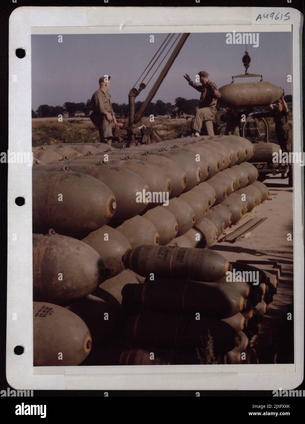 Ordnance Men Load 2000 Lb. Bombs On A Trailer At A Base Somewhere In ...