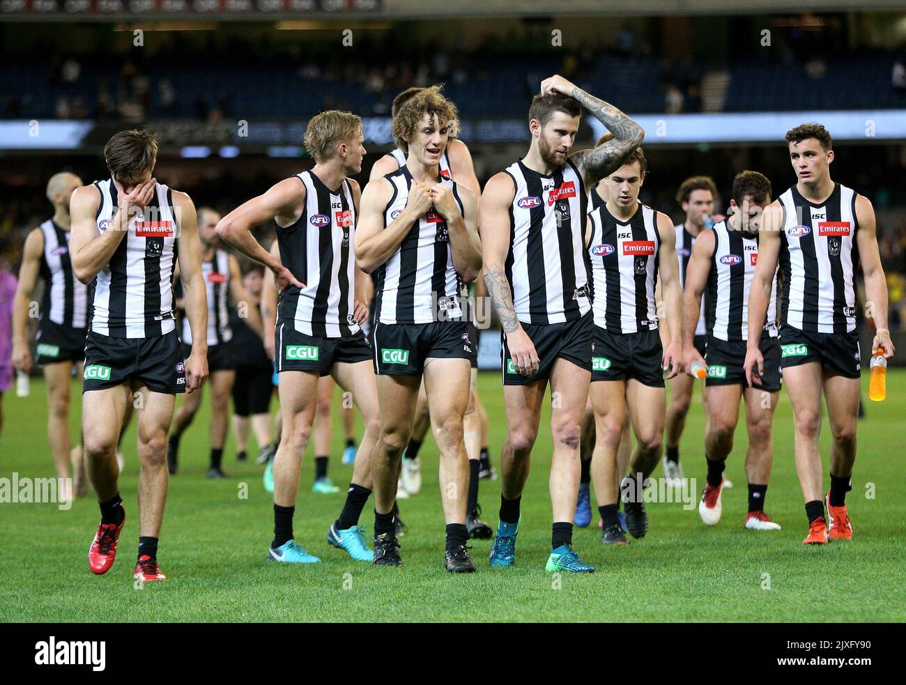 The Magpies team leave the field after their loss after the Round 6 AFL ...
